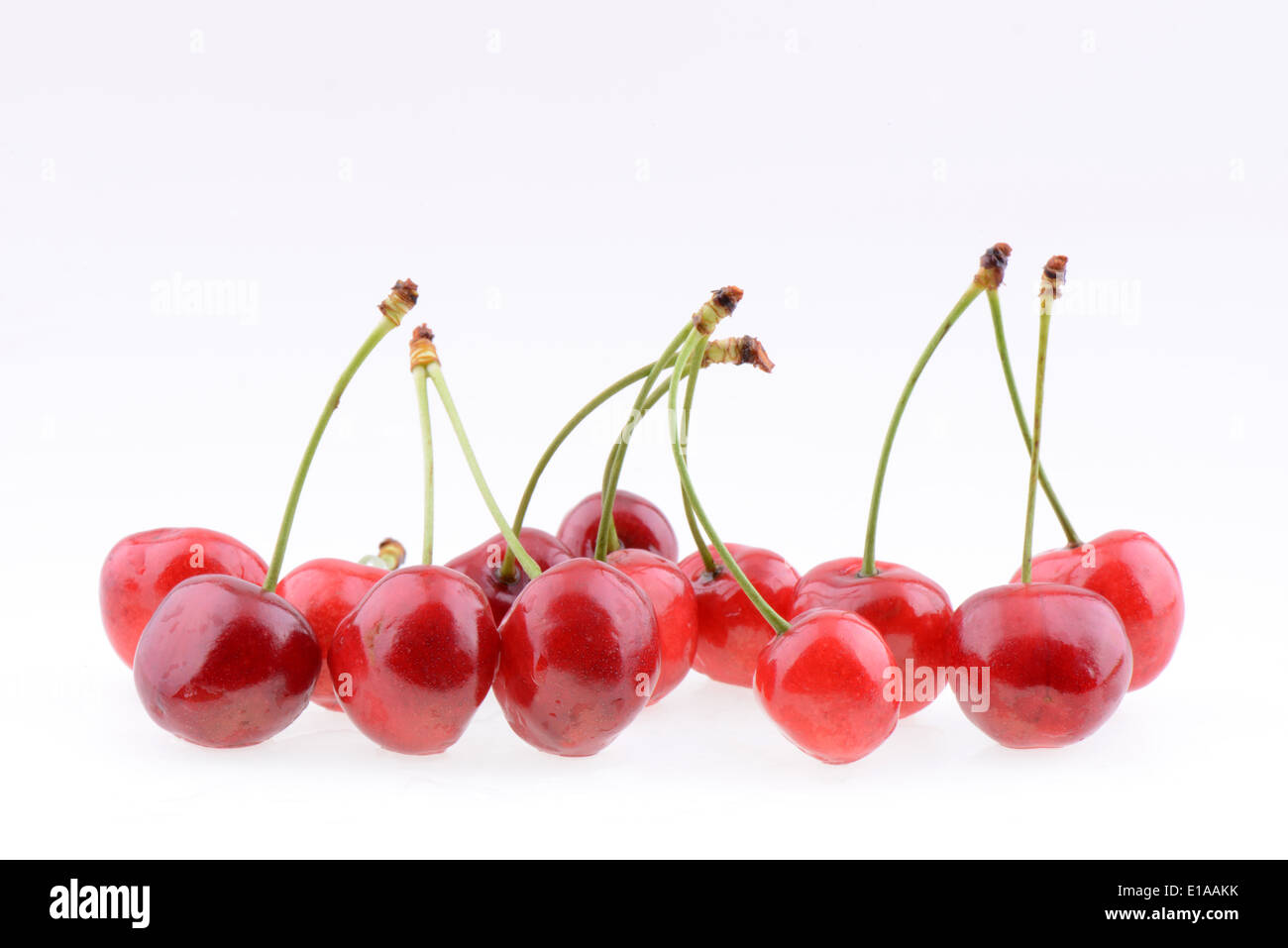 Sweet red cherries isolated on a white background Stock Photo - Alamy