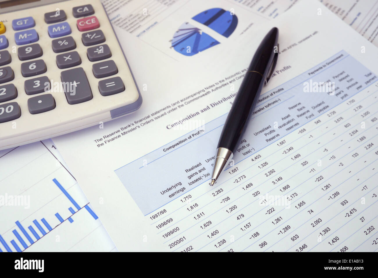 pen and blue profit graph on financial documents Stock Photo - Alamy