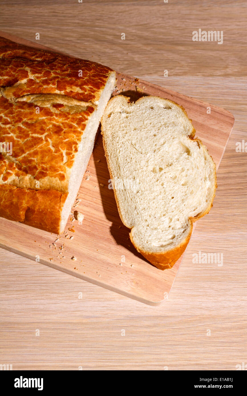 Fresh bread on a bread board Stock Photo - Alamy