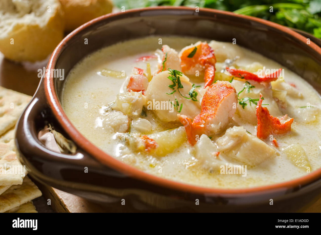 A steaming hot bowl of seafood chowder with lobster, clams, haddock ...