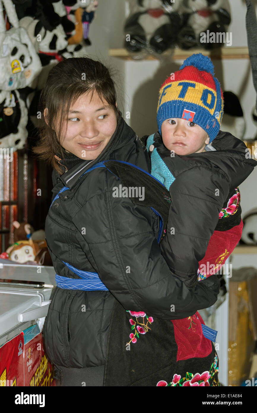 Proud mother looking back at her baby, Bifeng Xia, Sichuan, China Stock ...