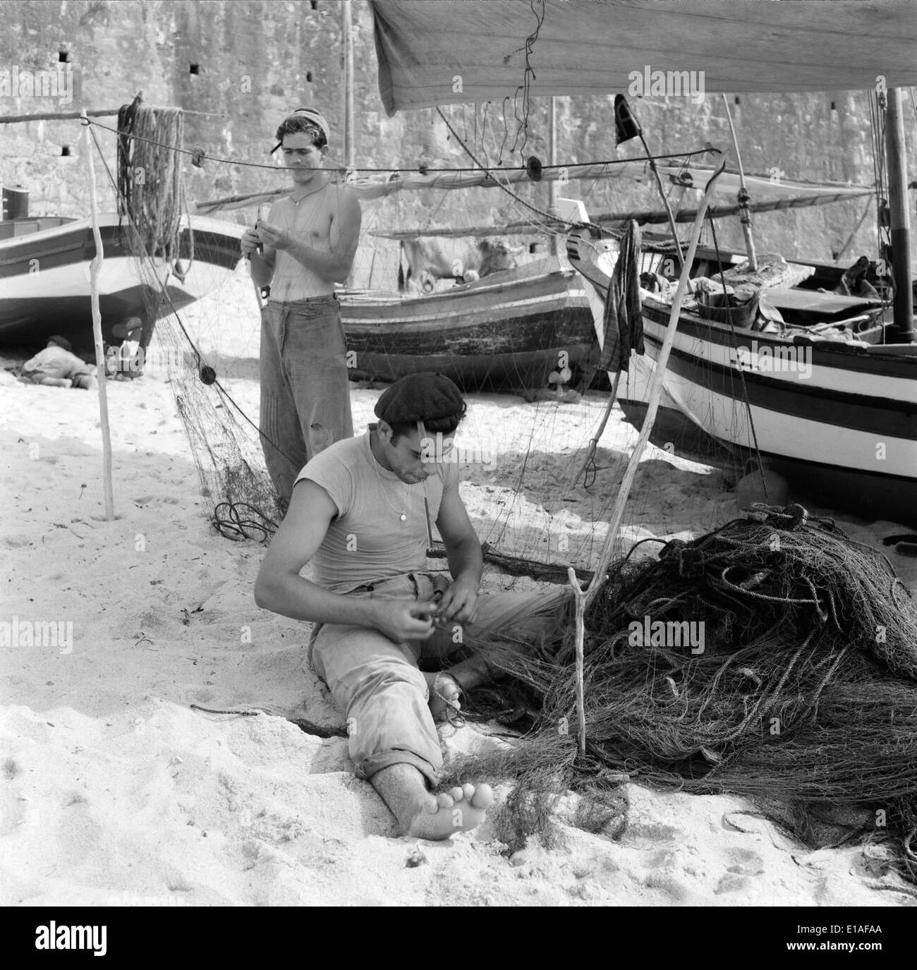 The restoration of fishing nets in Ericeira, Portugal, highlights the ...