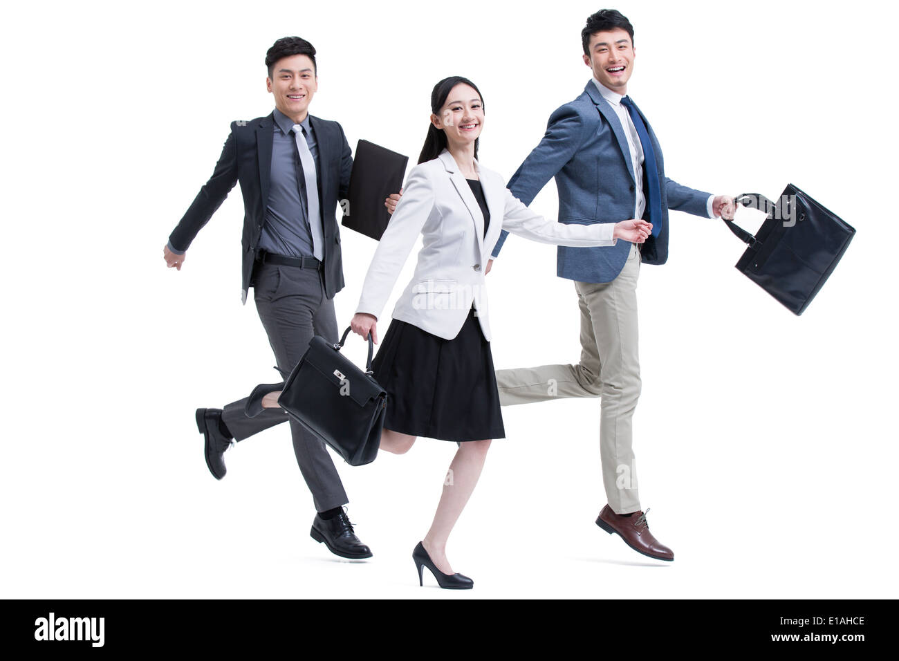 Excited business people on the move Stock Photo - Alamy