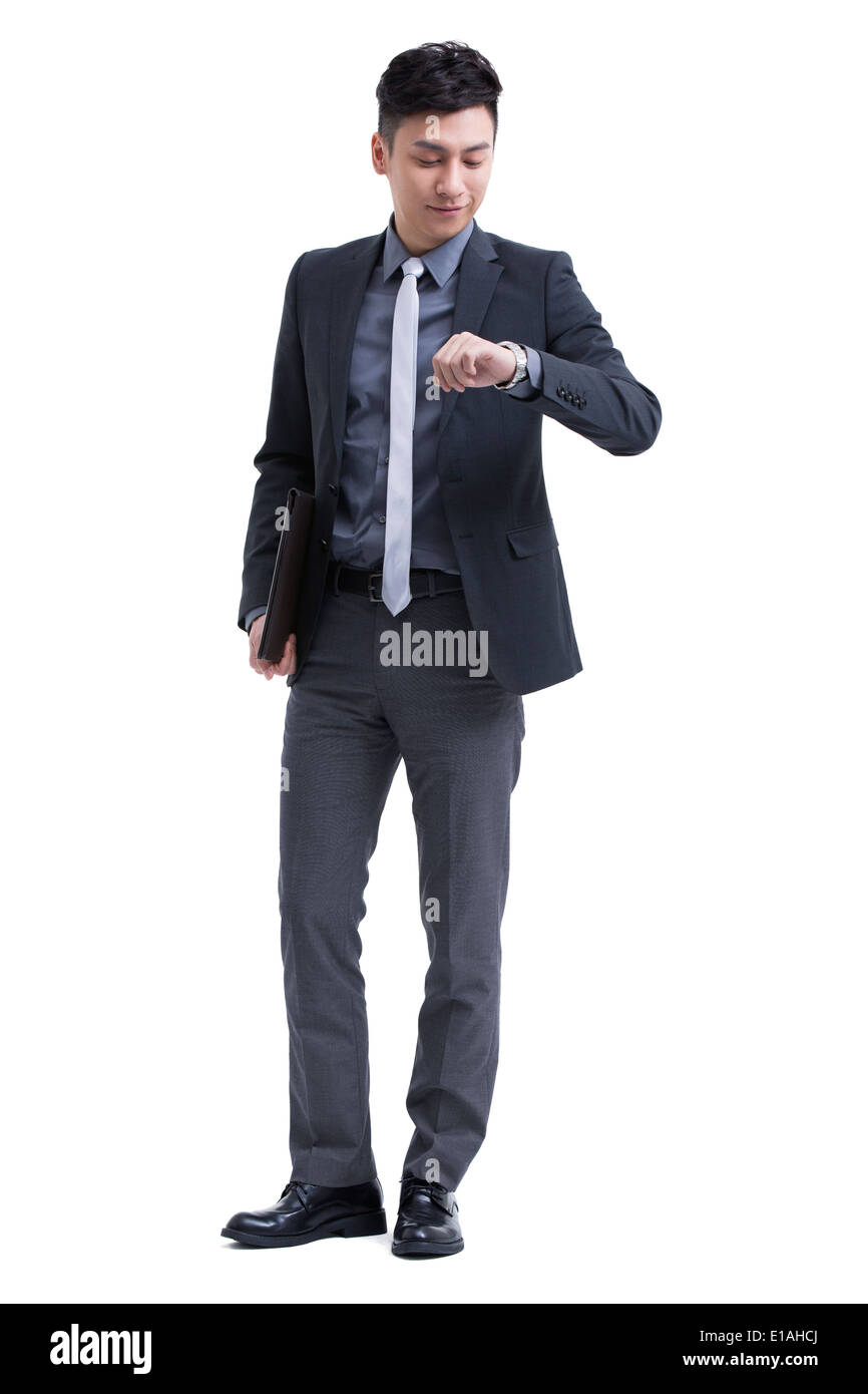 Business man checking time on Cut Out Stock Images & Pictures - Alamy