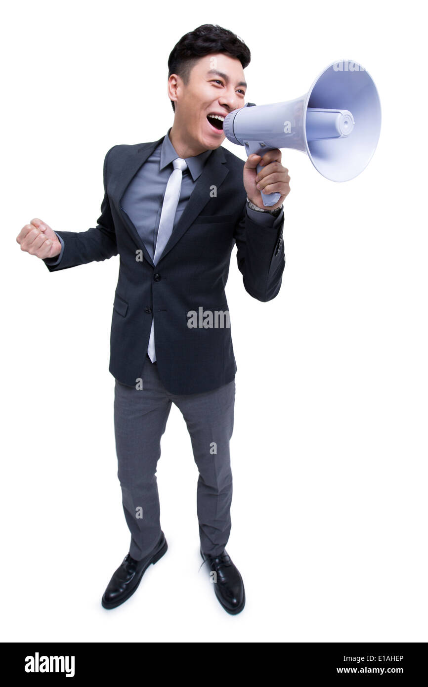 Cheerful businessman shouting into megaphone Stock Photo - Alamy