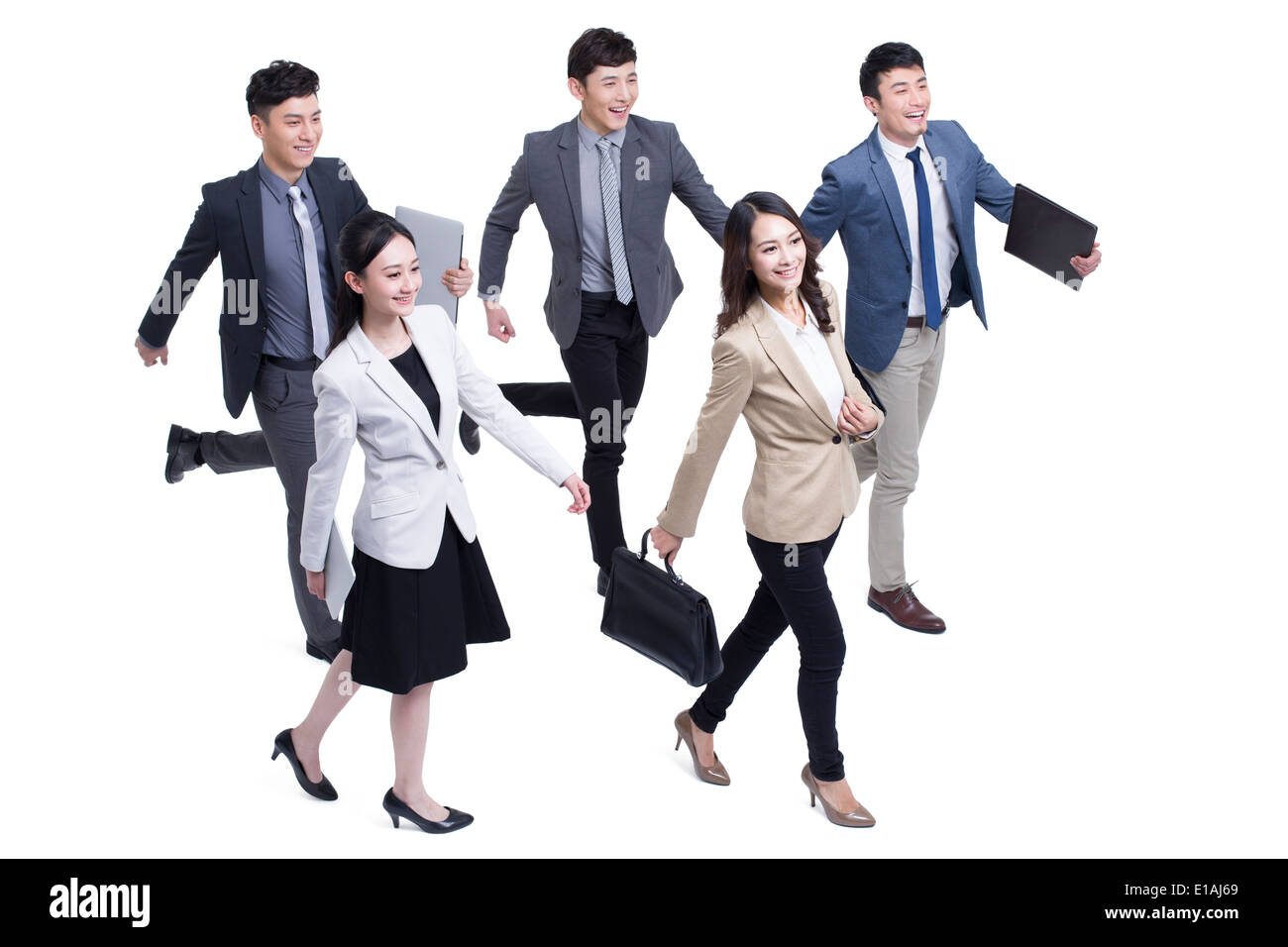 Business people walking forward confidently Stock Photo - Alamy