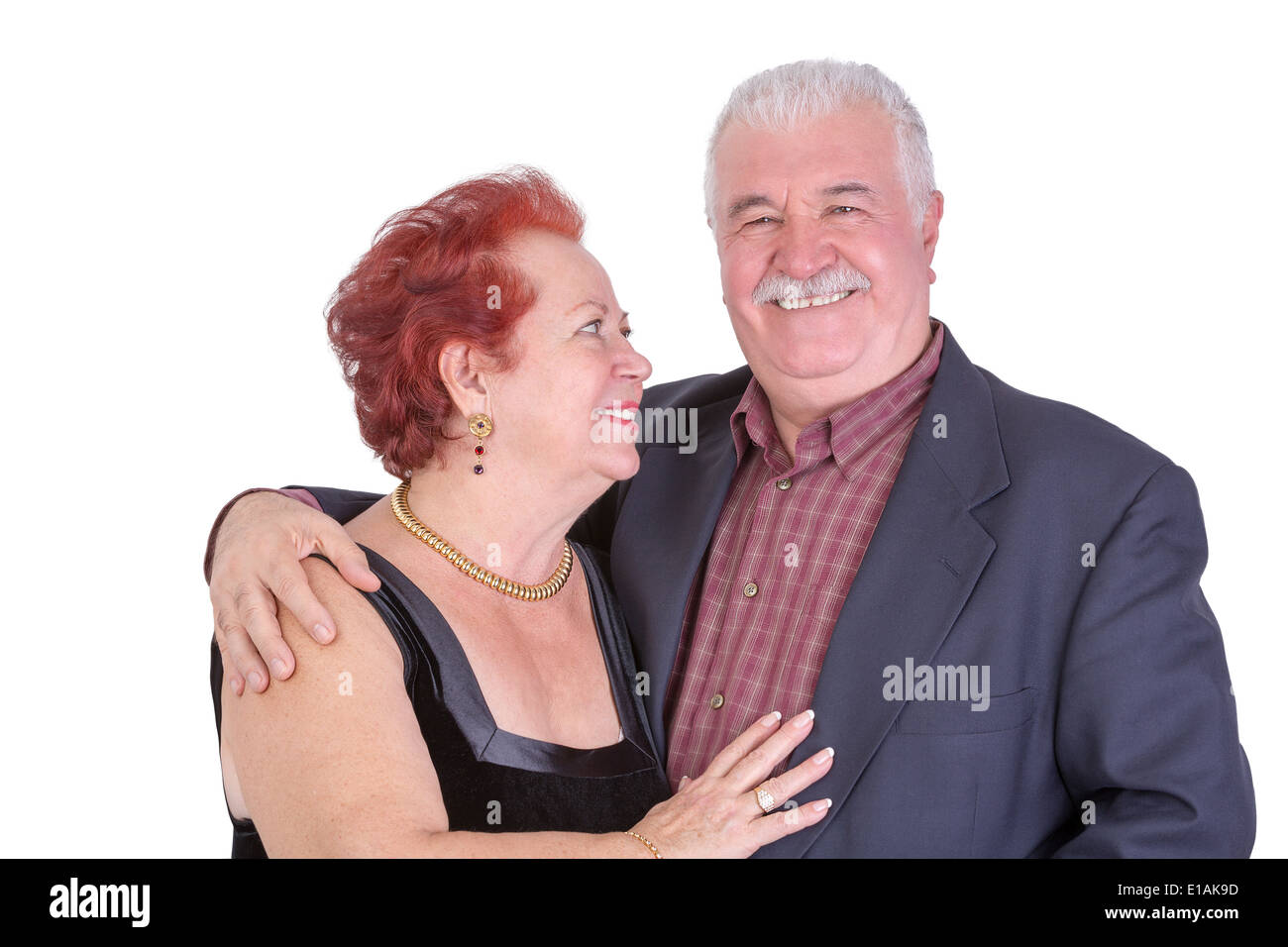 Senior couple, he is looking at you while she is proudly looking at him ...