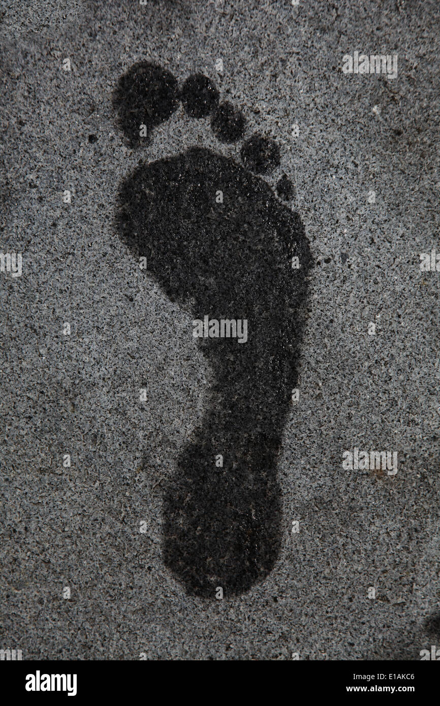 It's a photo of a foot print on the floor view form the top or top view ...