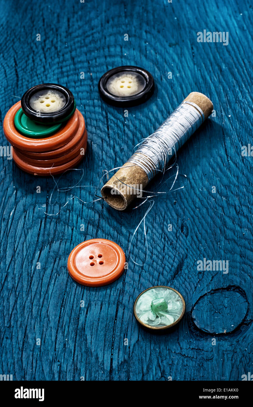 different buttons and zipper on the background of sewing tool Stock ...