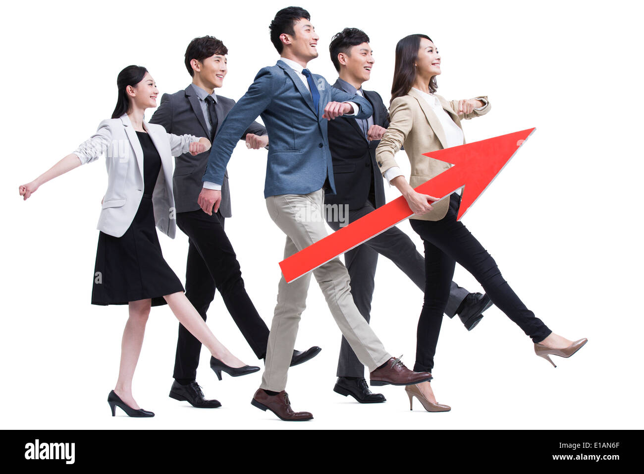 Young businessperson stepping forward with red arrow sign Stock Photo ...