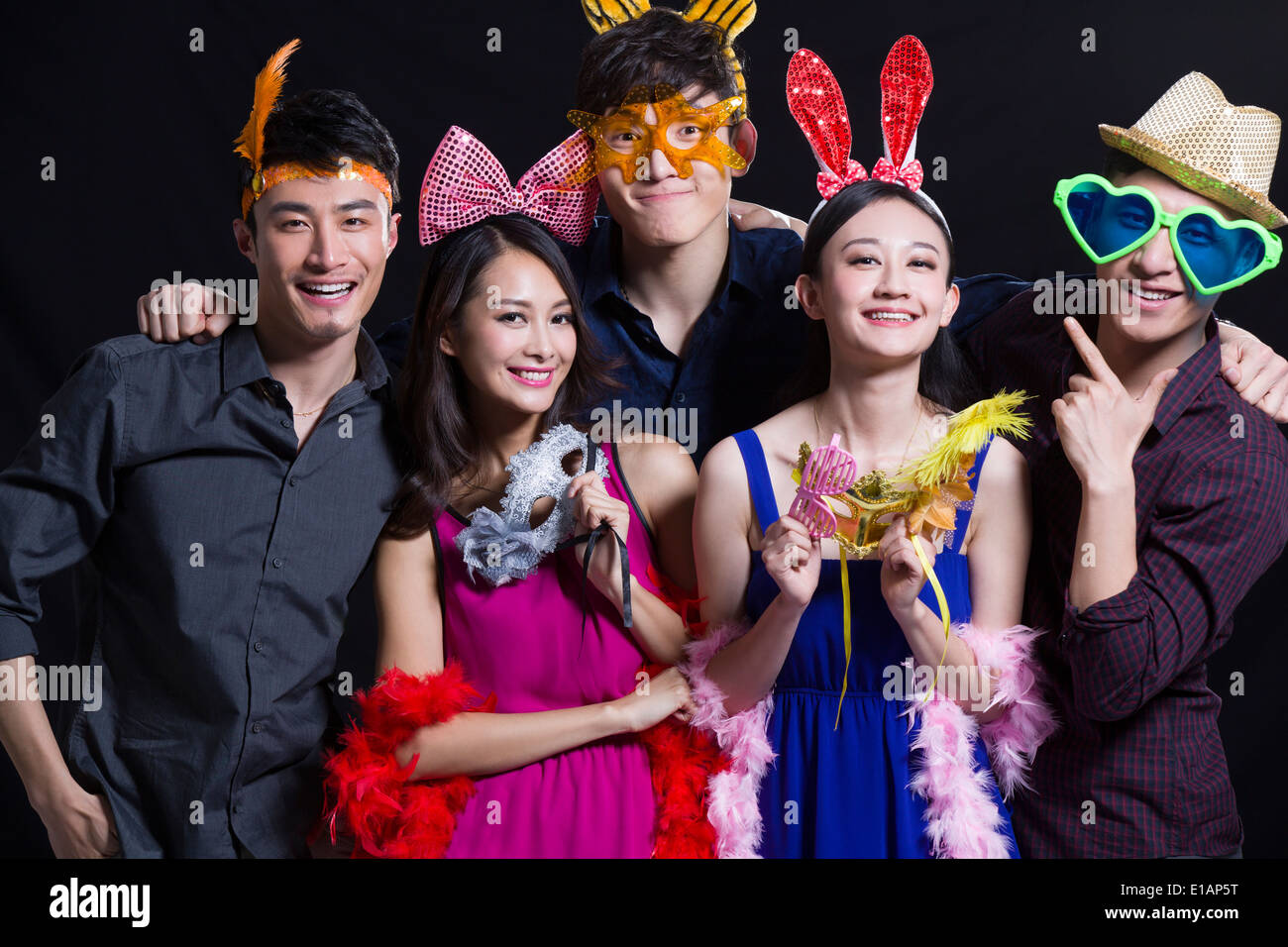 Young adults having a masked ball Stock Photo - Alamy