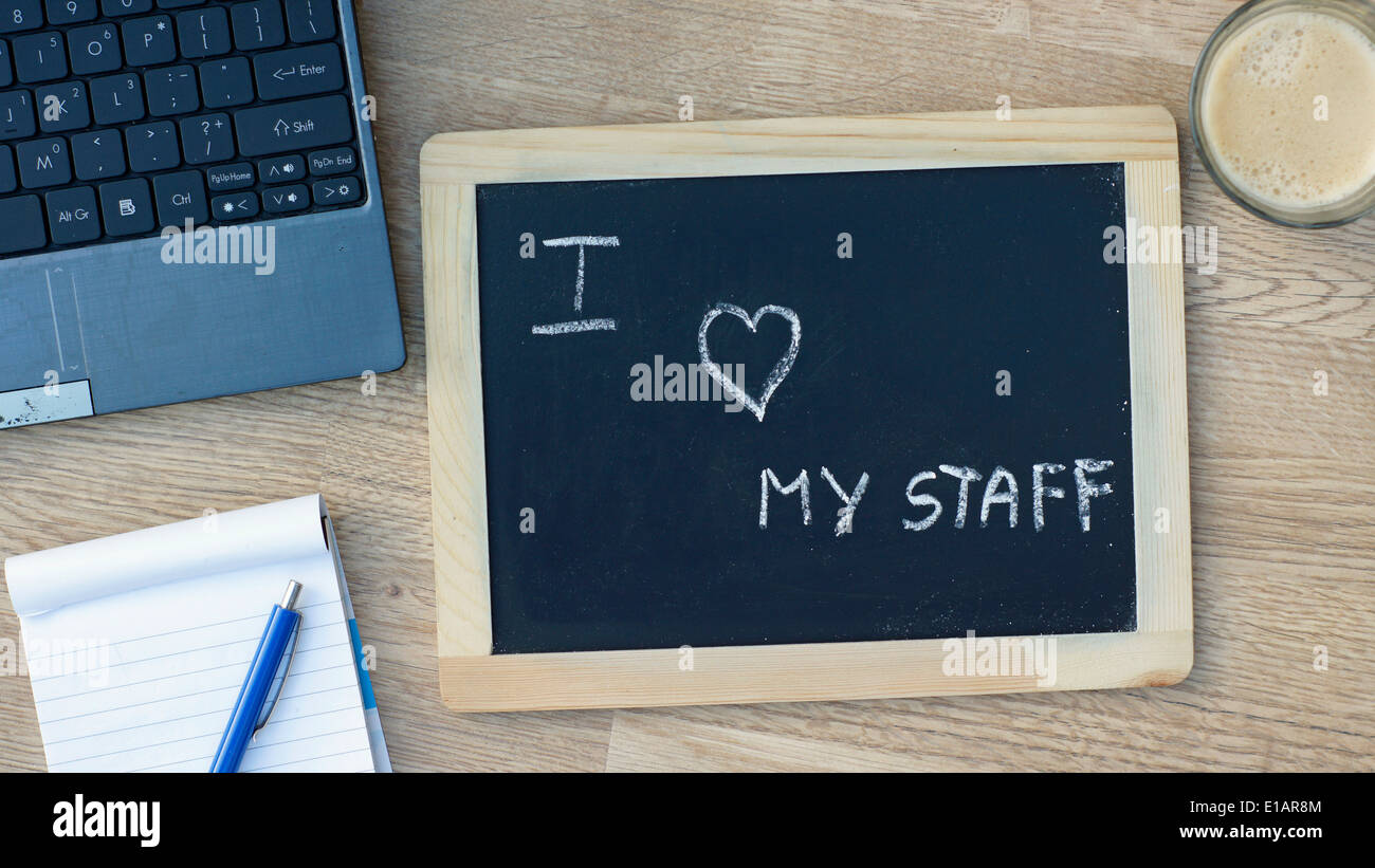 I love my staff written on a chalkboard at the office Stock Photo - Alamy
