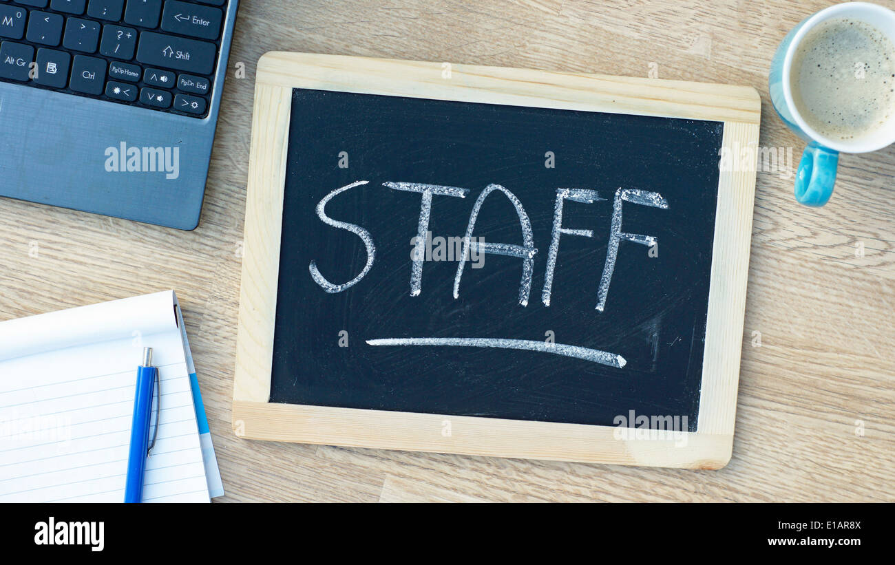 Staff written on a chalkboard at the office Stock Photo - Alamy