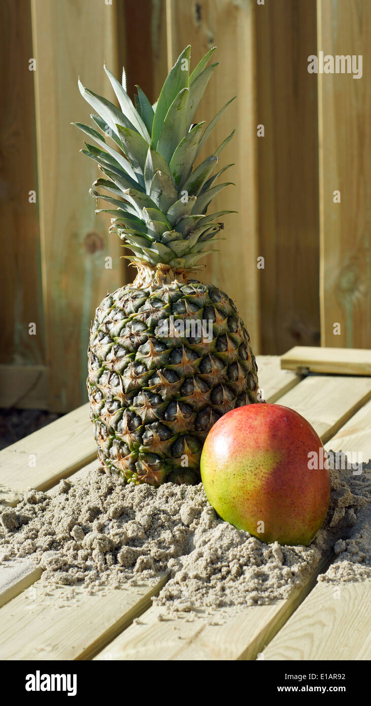 A mango and a pineapple at the beach Stock Photo - Alamy