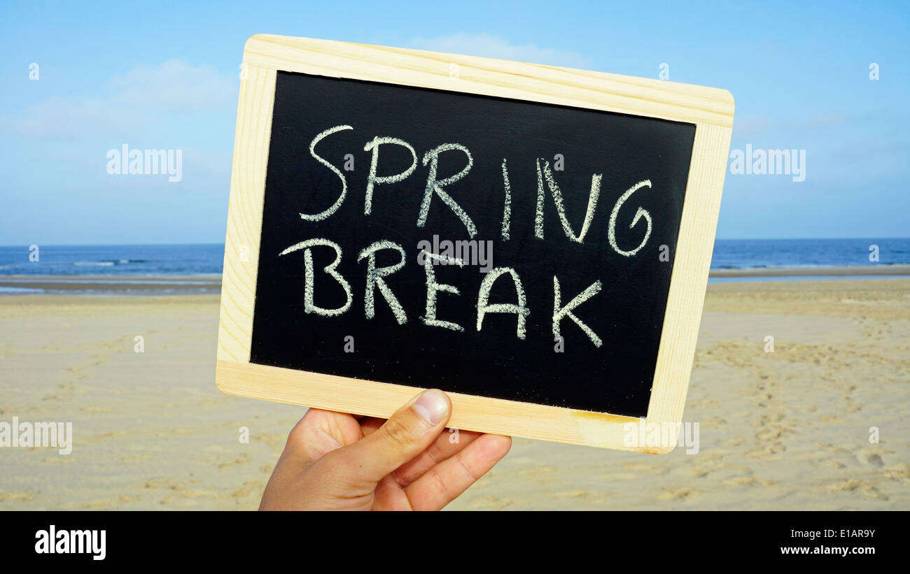 Spring break written on a chalkboard at the beach Stock Photo - Alamy