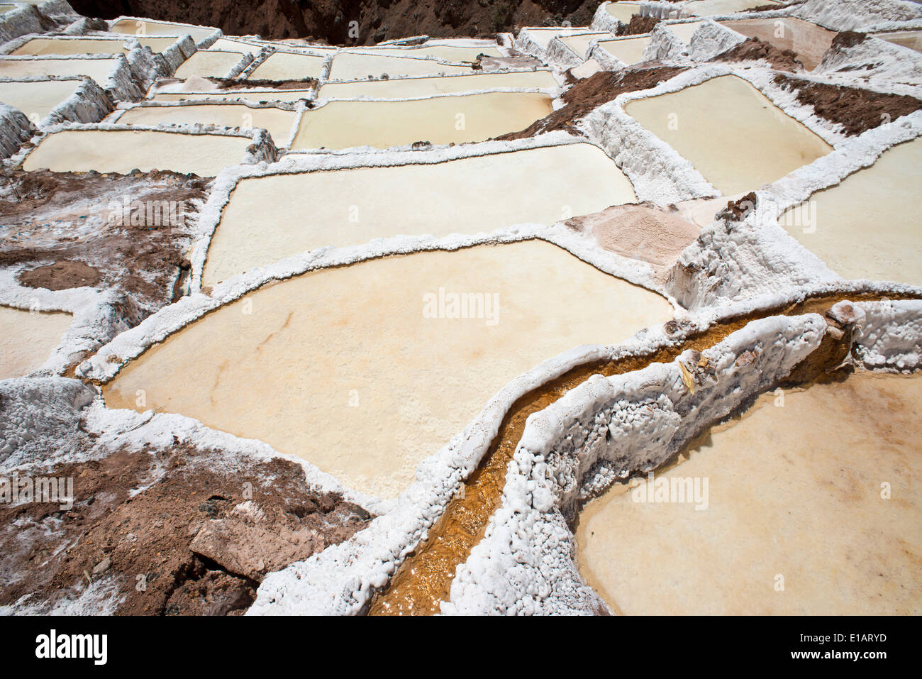 Salt pans with water course on a mountainside, Salinas de Maras salt ...