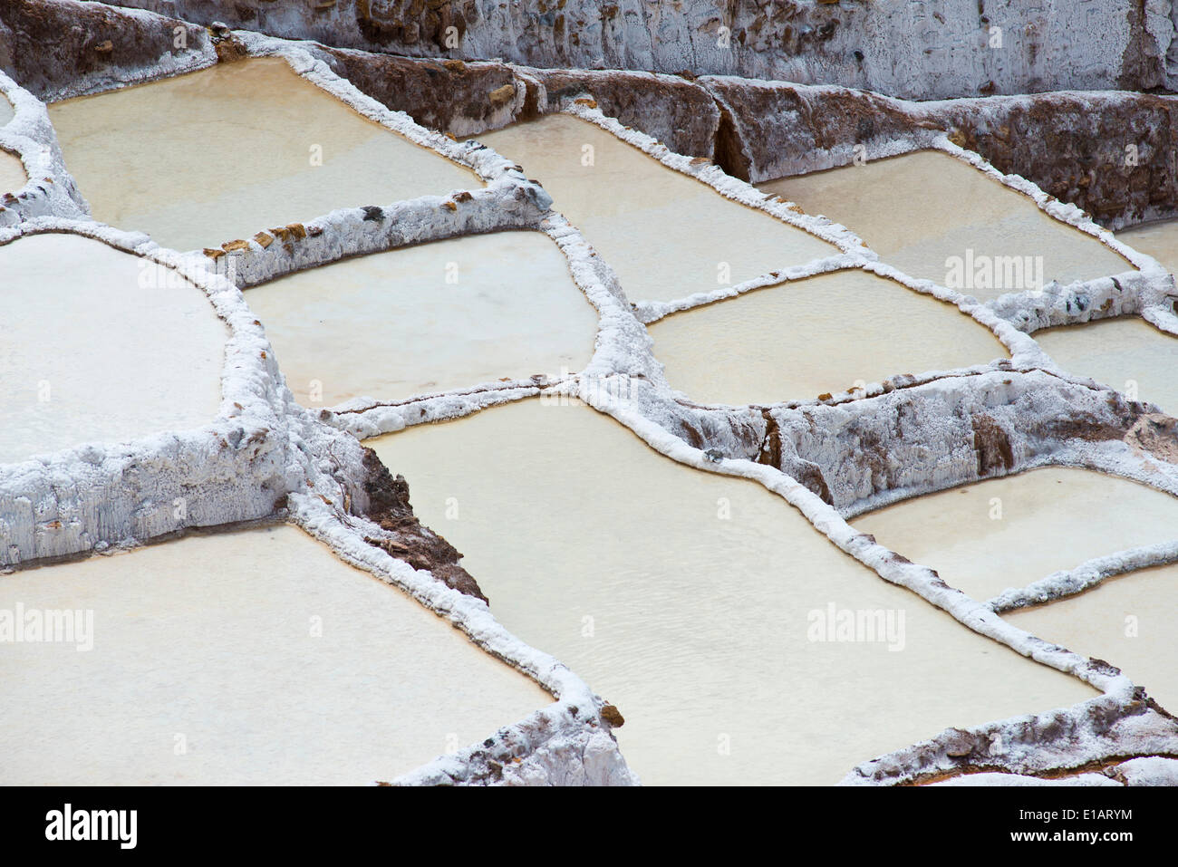 Salt pans on a mountainside, Salinas de Maras salt pans, created by the ...