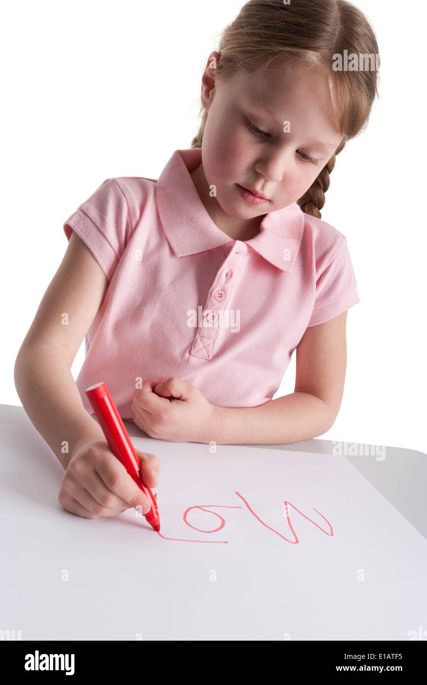 Little girl writing letters on white background Stock Photo - Alamy