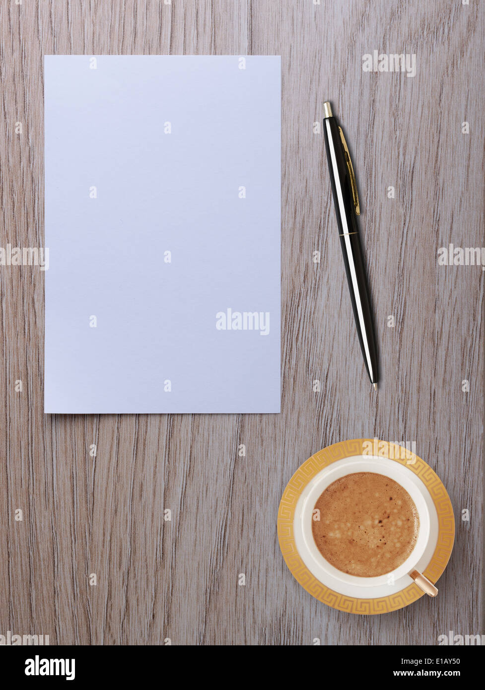 white blank sheet of paper with pen and cup of coffee on your desktop ...