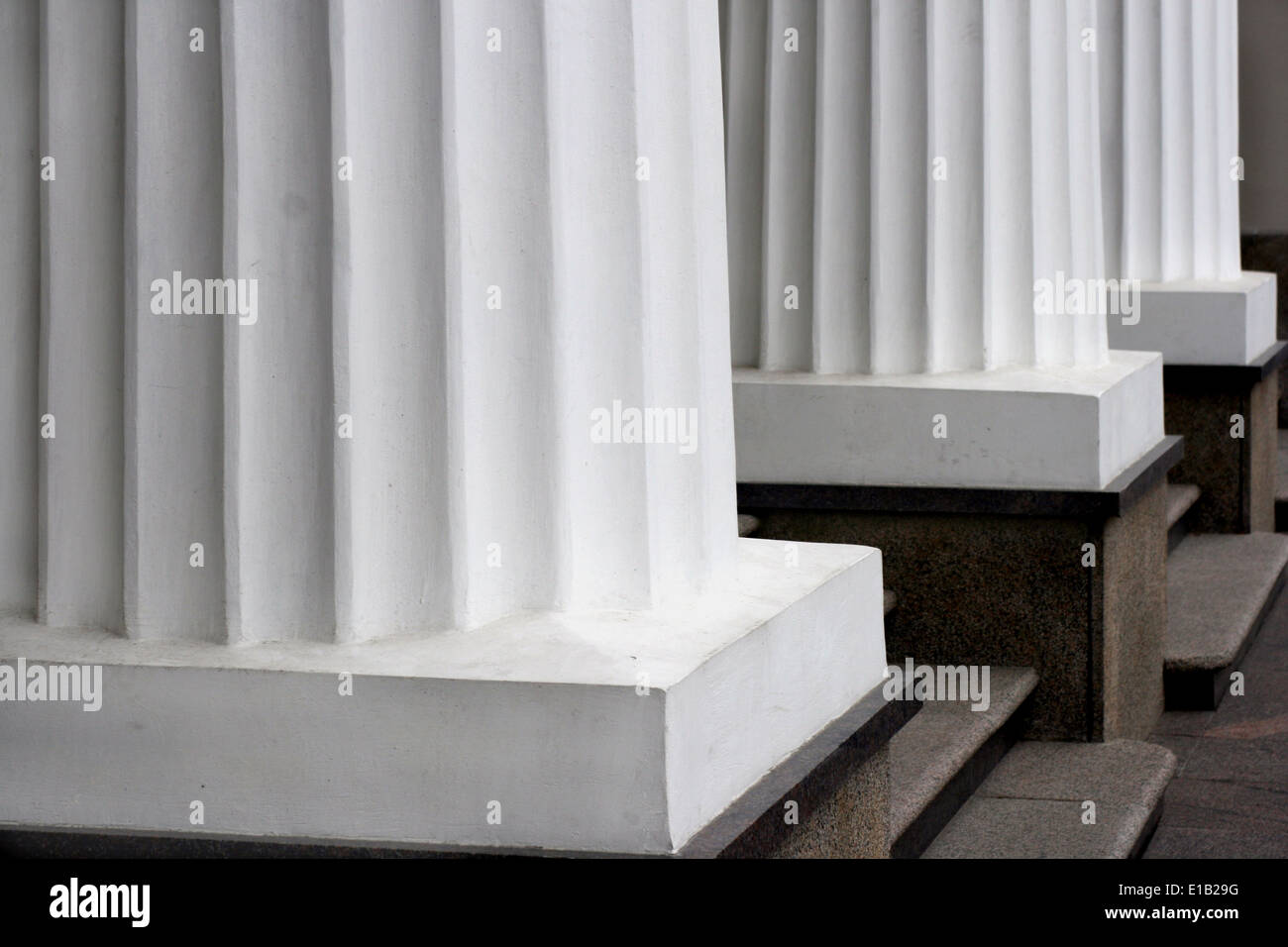 Three classical white greek columns in a row Stock Photo - Alamy