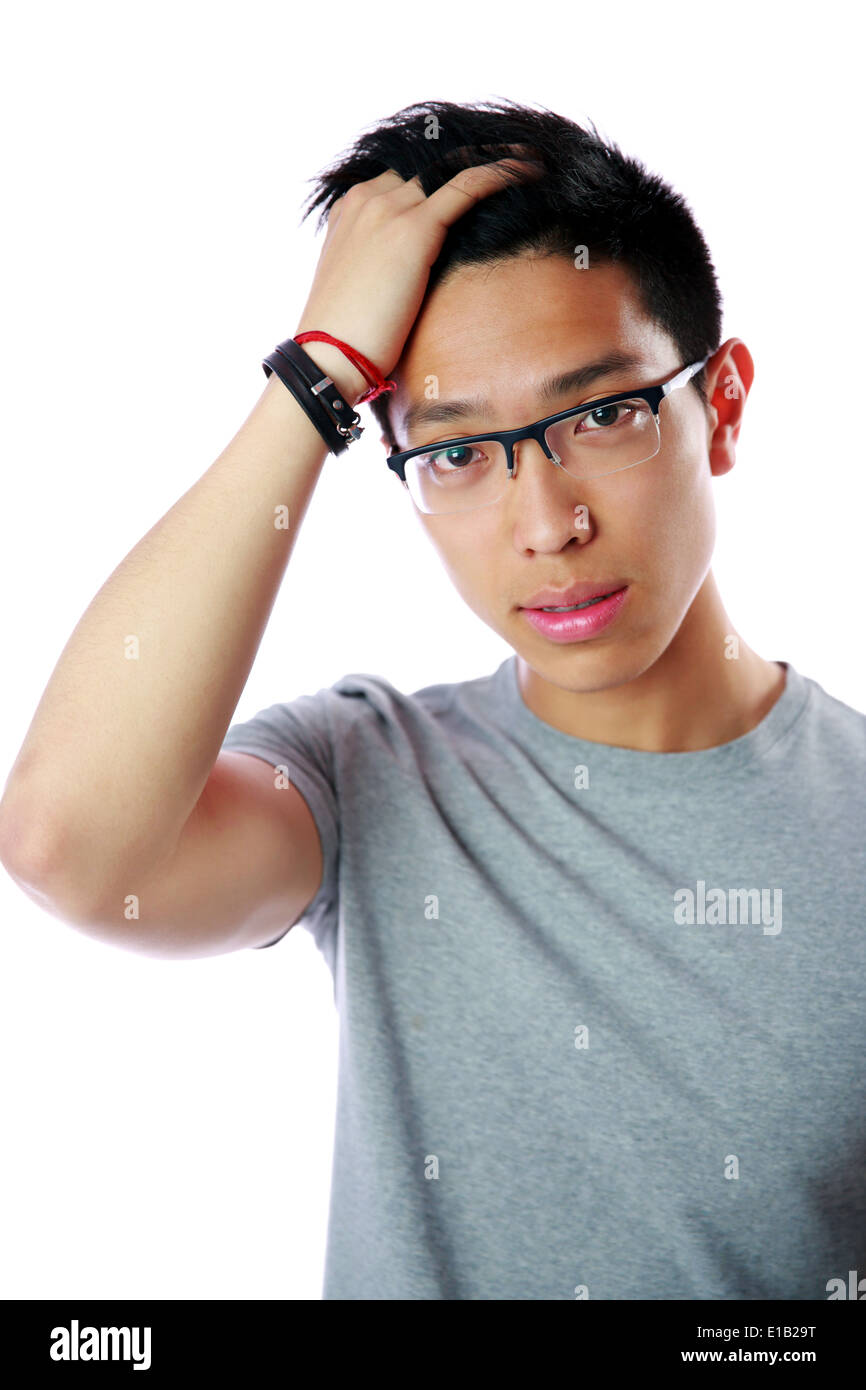 Portrait of a young serious asian man over white background Stock Photo ...