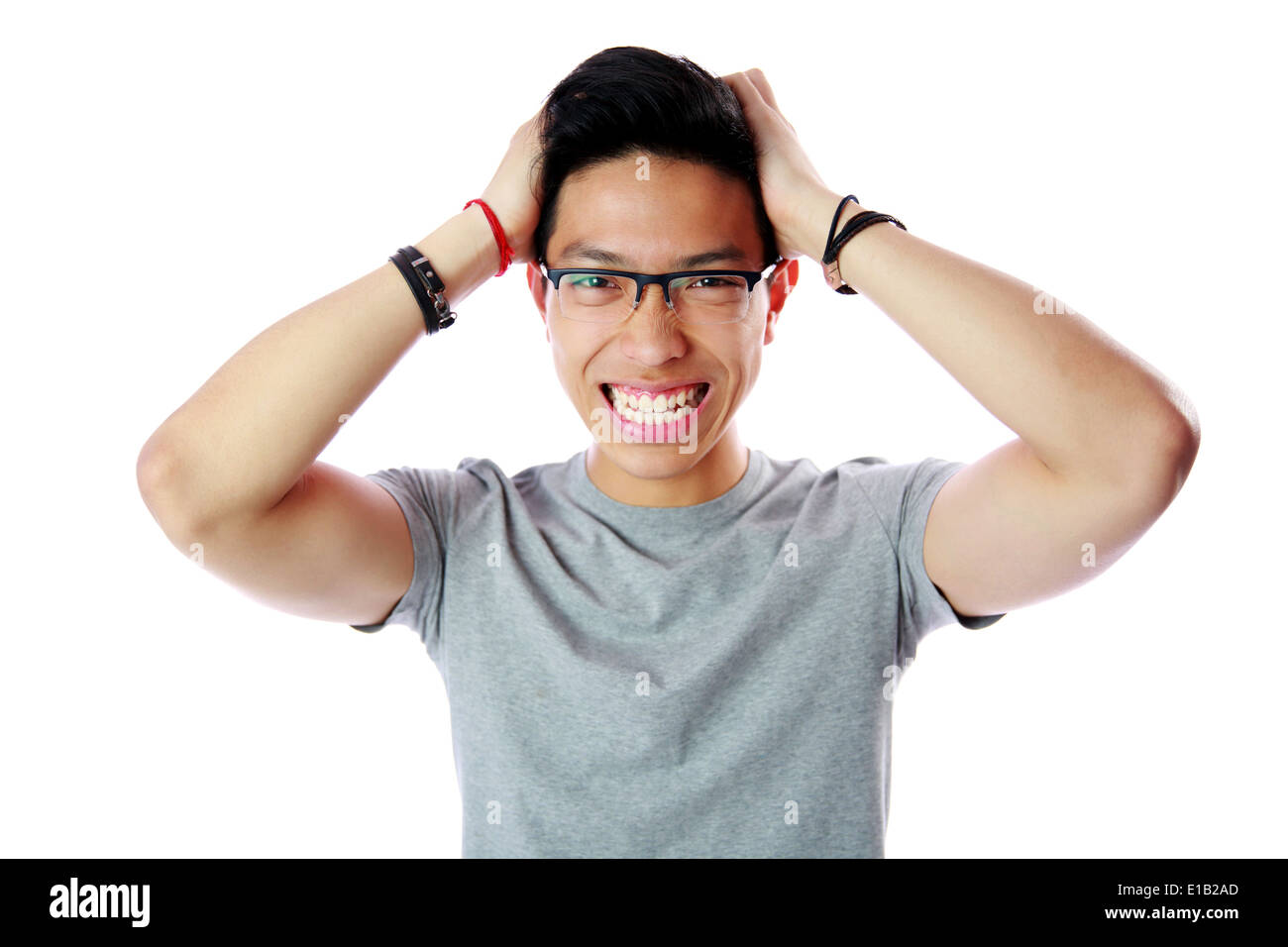 Funny asian man touching his head over white background Stock Photo - Alamy