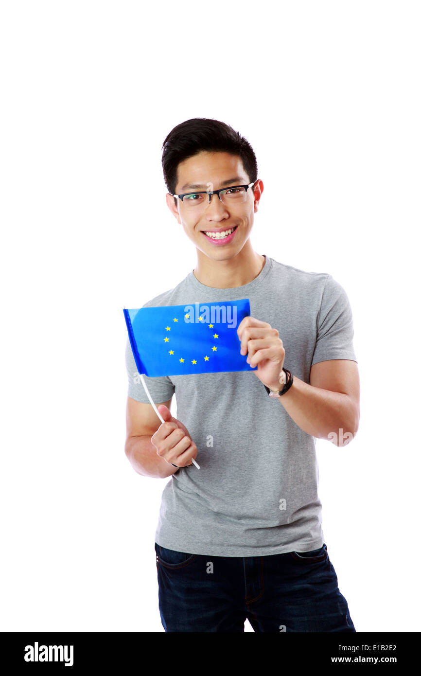 Happy young asian man holding flag of europe union over white ...
