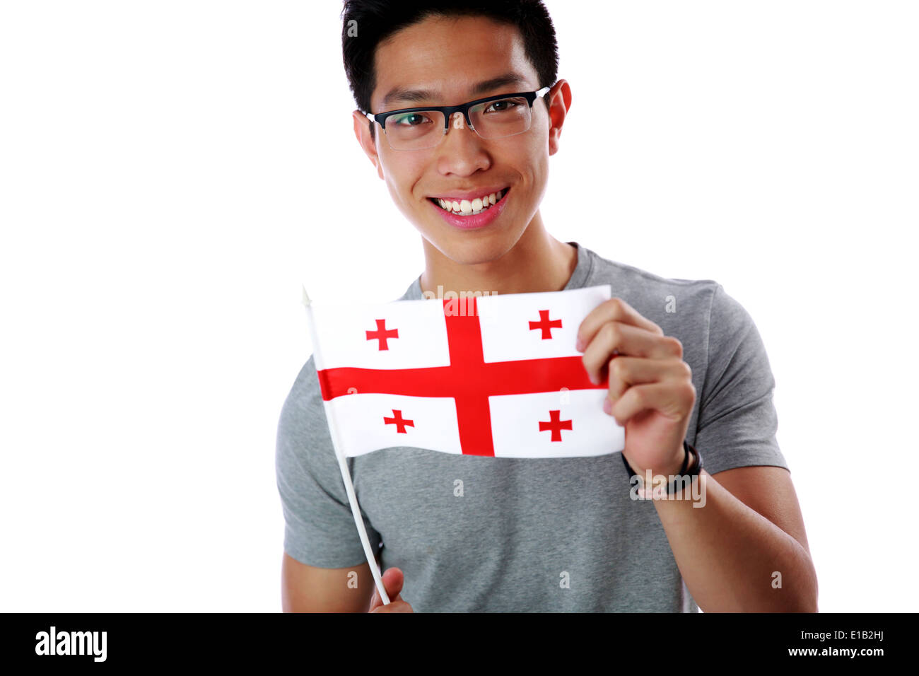 Happy asian man holding flag of Georgia over white background Stock ...