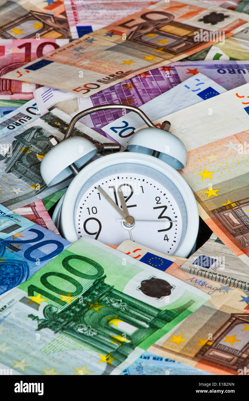 Money time clock business hi-res stock photography and images - Alamy