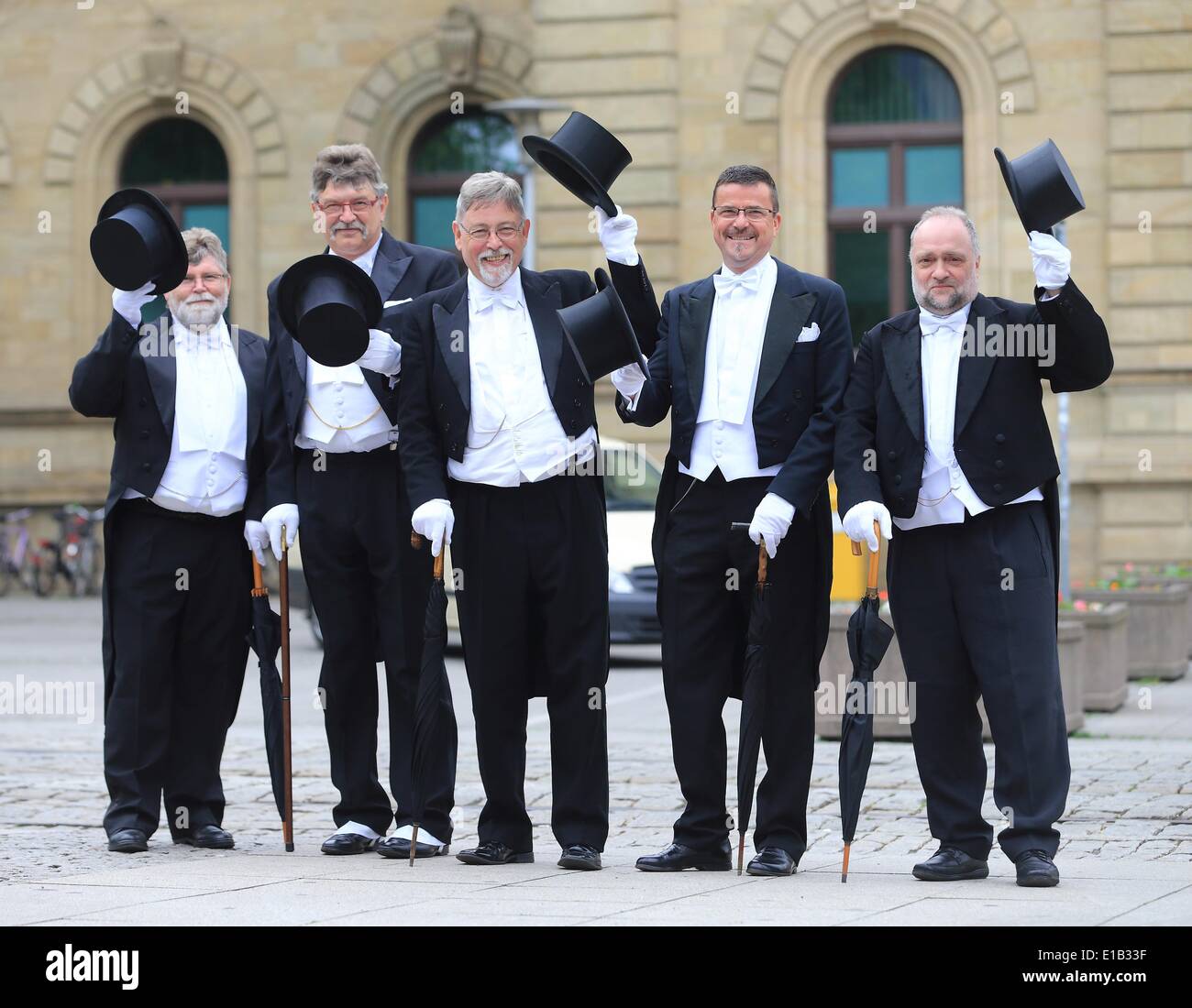 Magdeburg, Germany. 29th May, 2014. Five men wearing tails and top hats ...