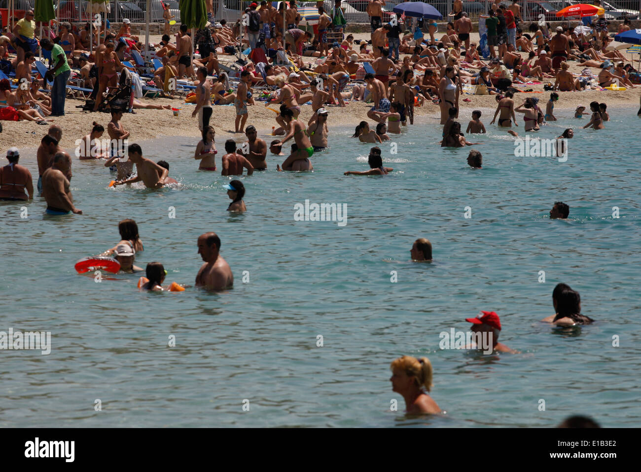 This picture shows people cooling off at one of the capital's beaches ...
