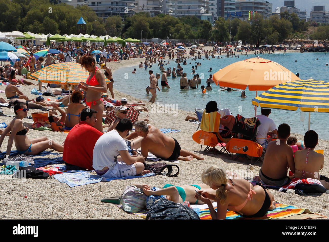 This picture shows people cooling off at one of the capital's beaches ...