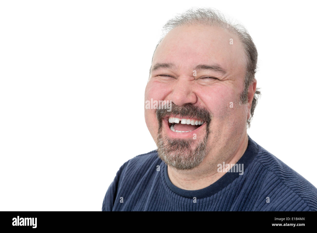 Close-up portrait of a funny mature man laughing hard on a white ...