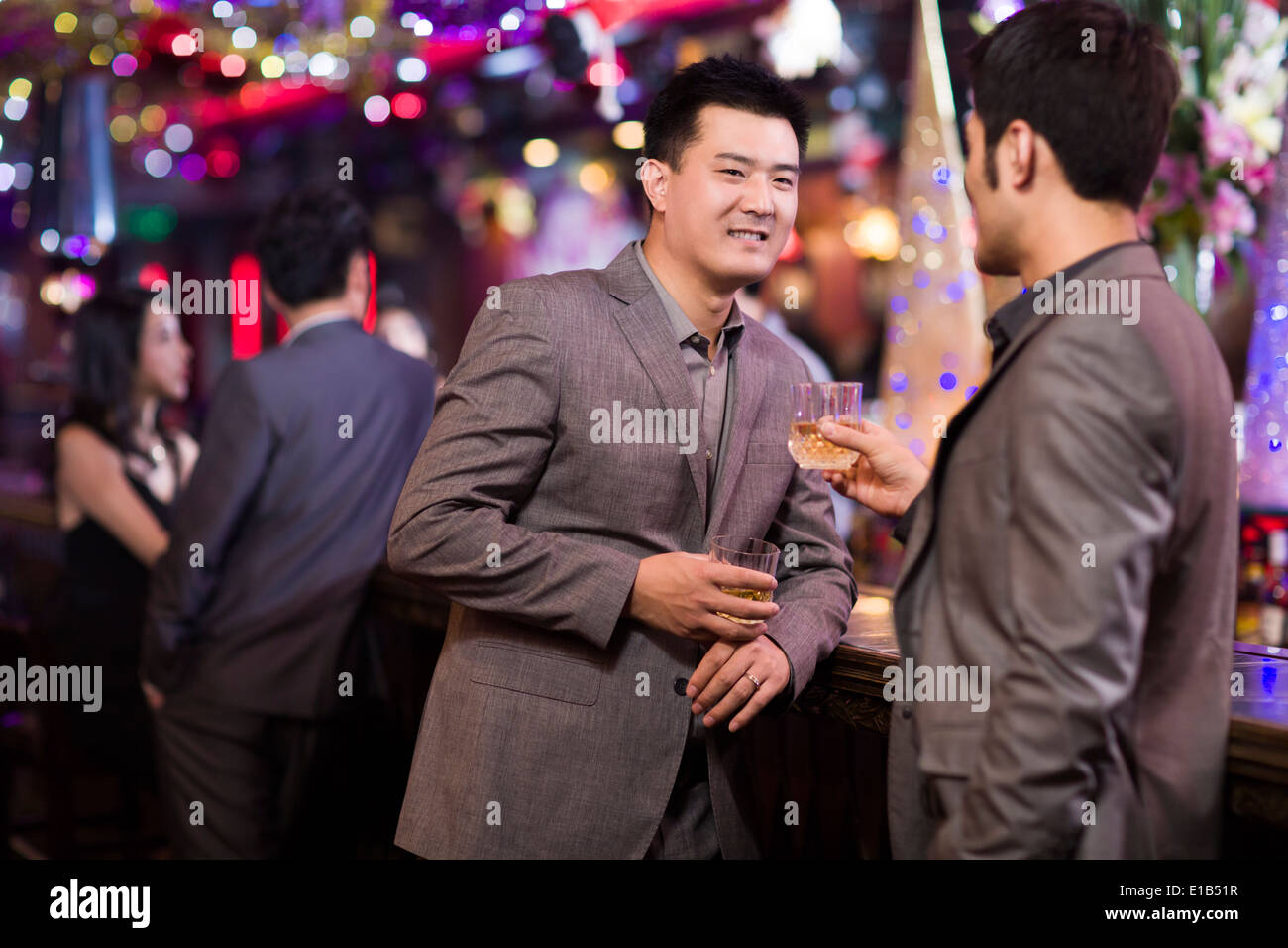 Business partners talking in bar Stock Photo - Alamy