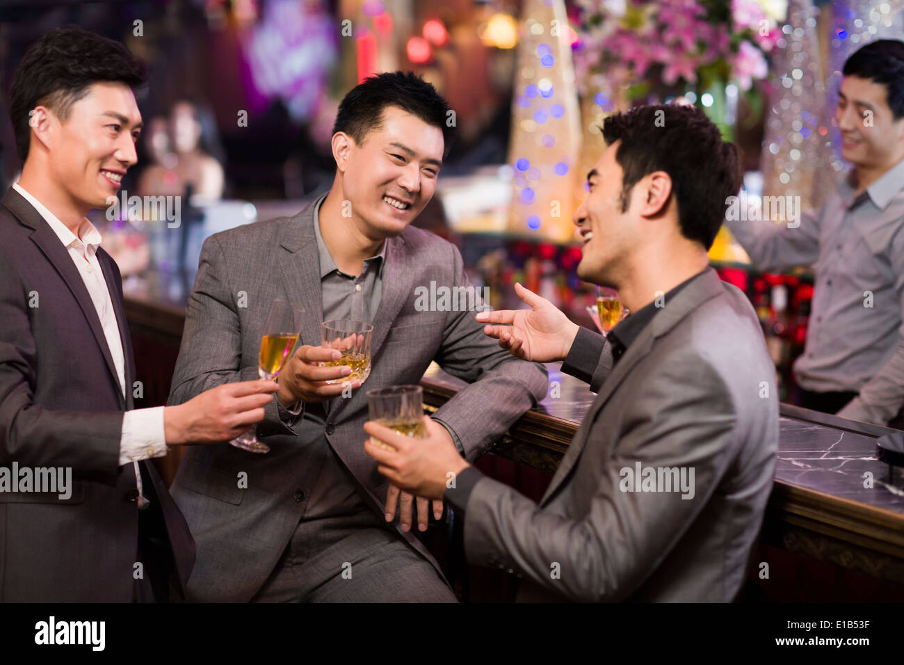 Business partners talking in bar Stock Photo - Alamy