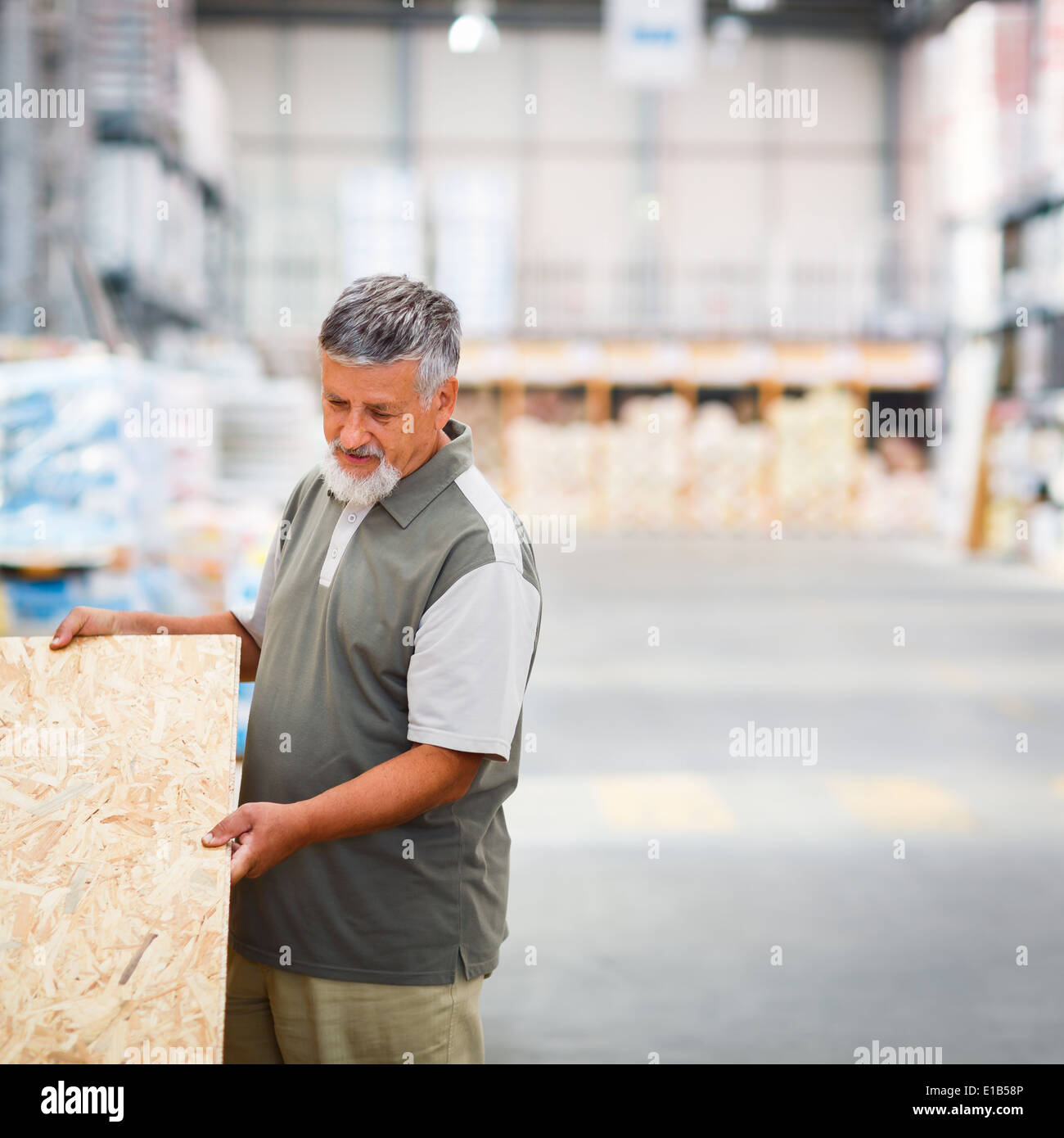 Man buying construction wood in a DIY store for his DIY home re ...