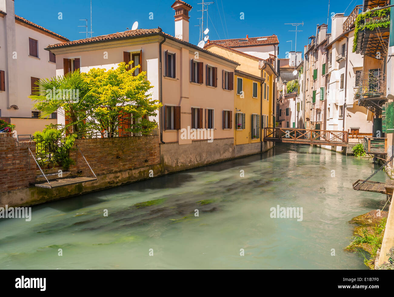 Beautiful green waters of a river in the Italian town of Treviso Stock ...
