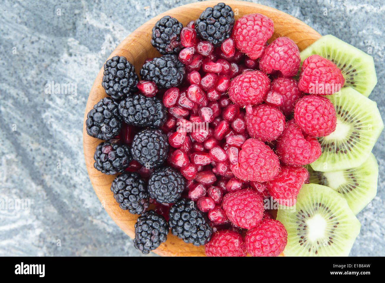Healthy breakfast of fresh fruit with sliced tropical kiwifruit ...