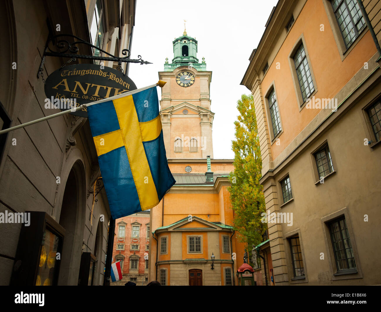 A Swedish flag is draped in front of a store on Trångsund, as the clock ...