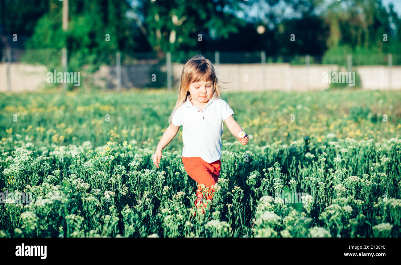 Smiling cute little girl running Stock Photo - Alamy