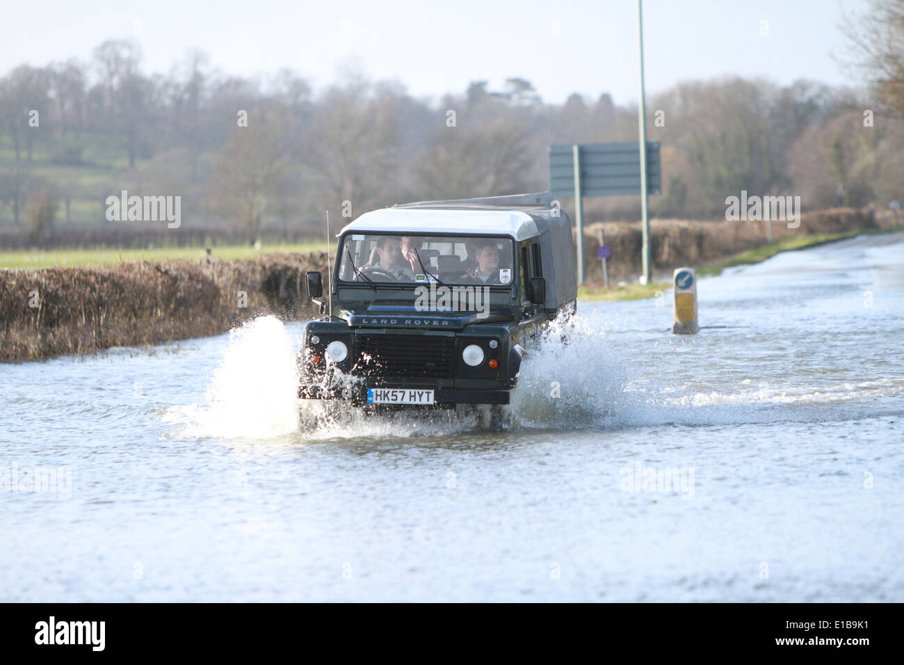 Land Rover driving through flood water Stock Photo - Alamy