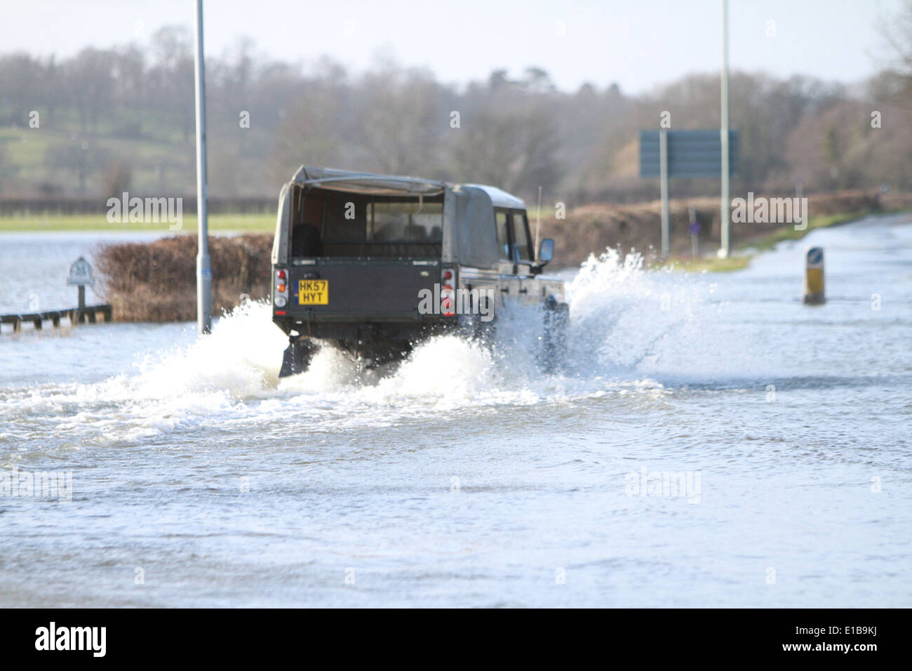 Land Rover driving through flood water Stock Photo - Alamy