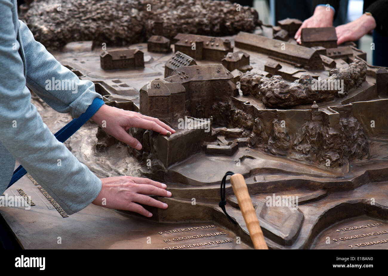 Blind and visually impaired people touch the new examination model of ...