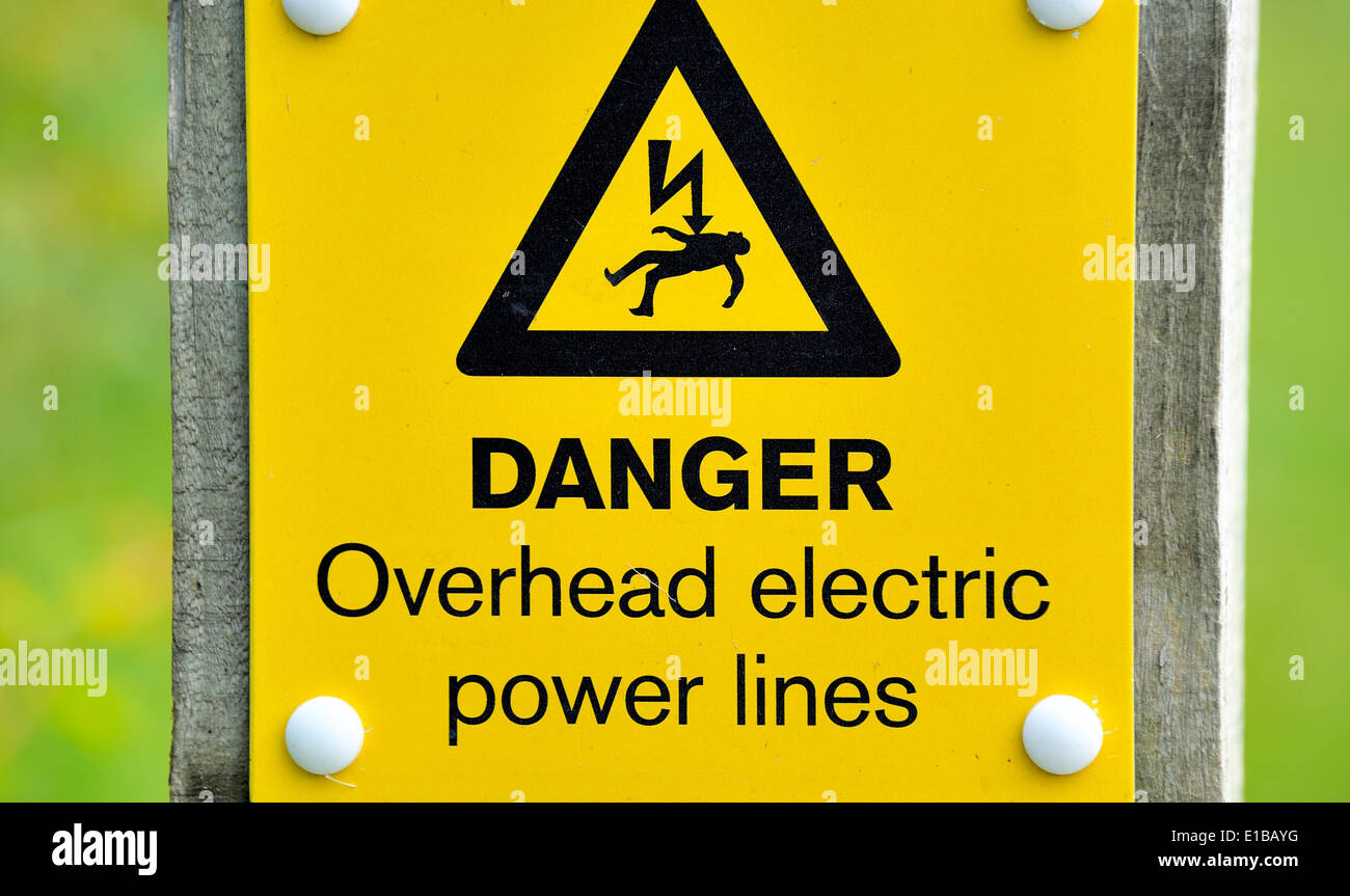 Danger overhead electric power lines yellow sign Stock Photo: 69706212 ...