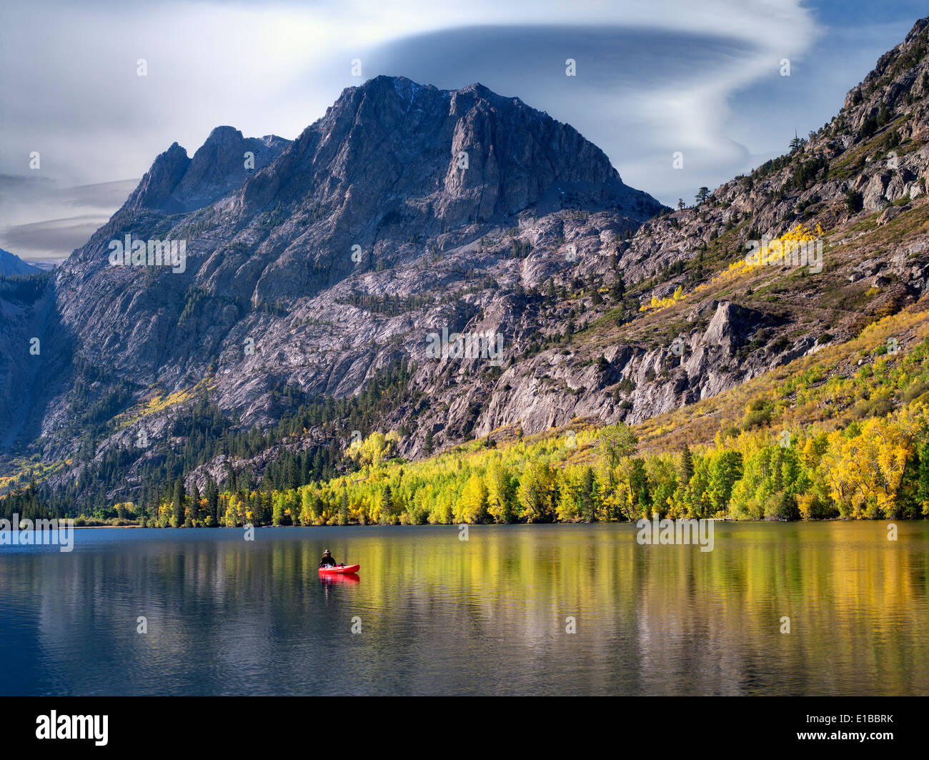 Silver Lake reflection with fall colored cottonwood trees and boat with ...