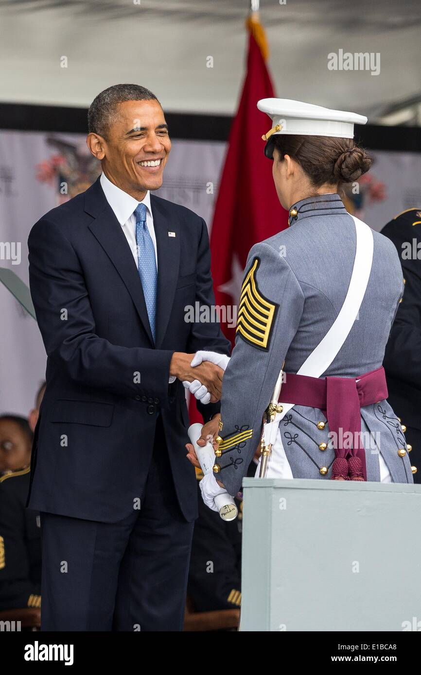US President Barack Obama shakes hands with a female cadet at ...