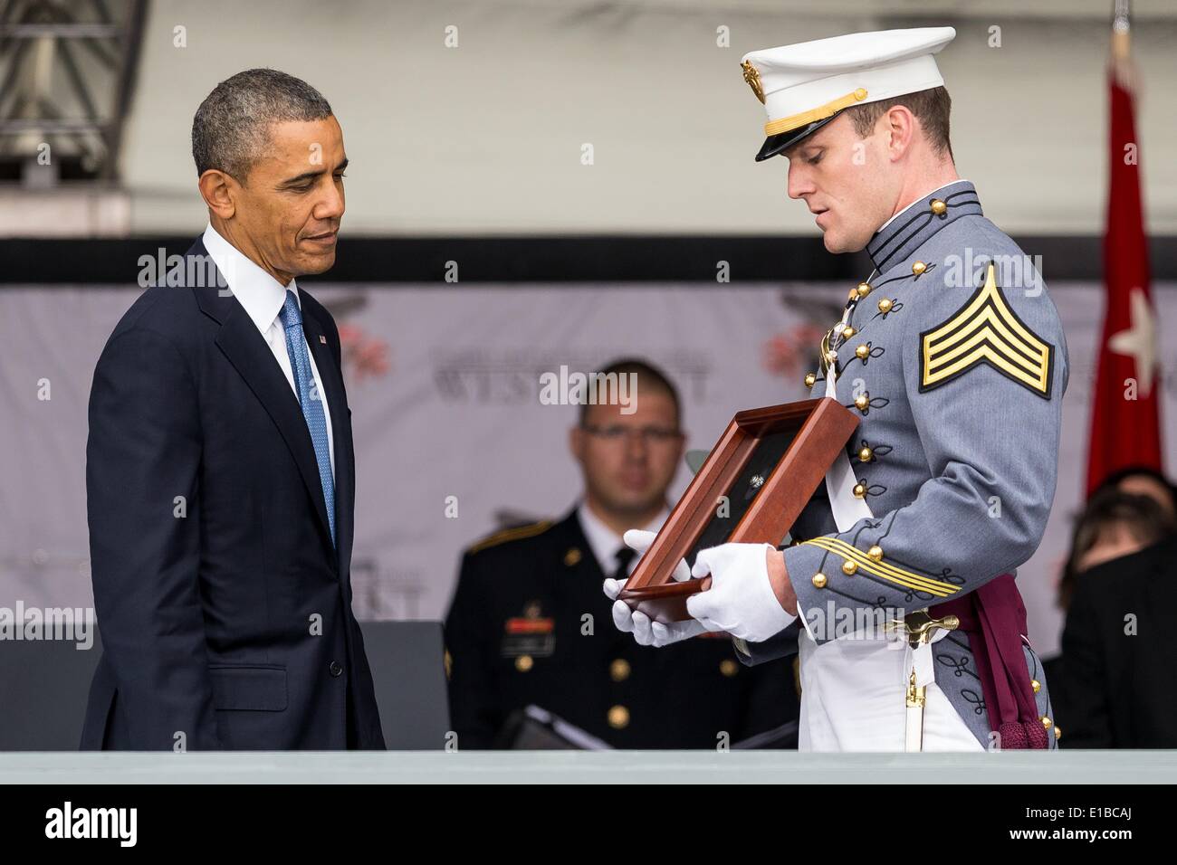 US President Barack Obama con graduates a cadet during graduation ...