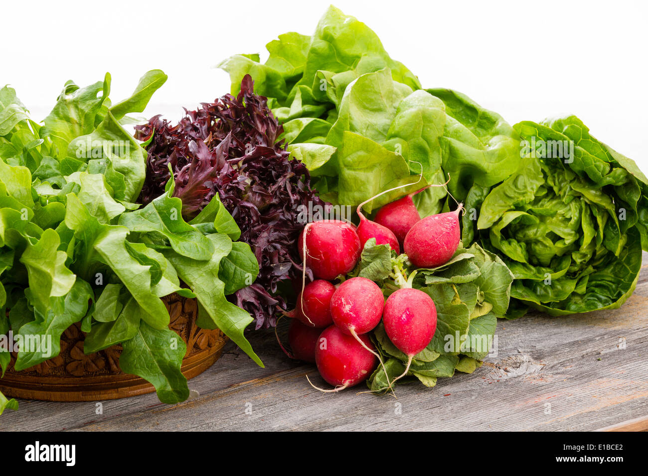 Healthy fresh salad ingredients displayed on old weathered wooden ...
