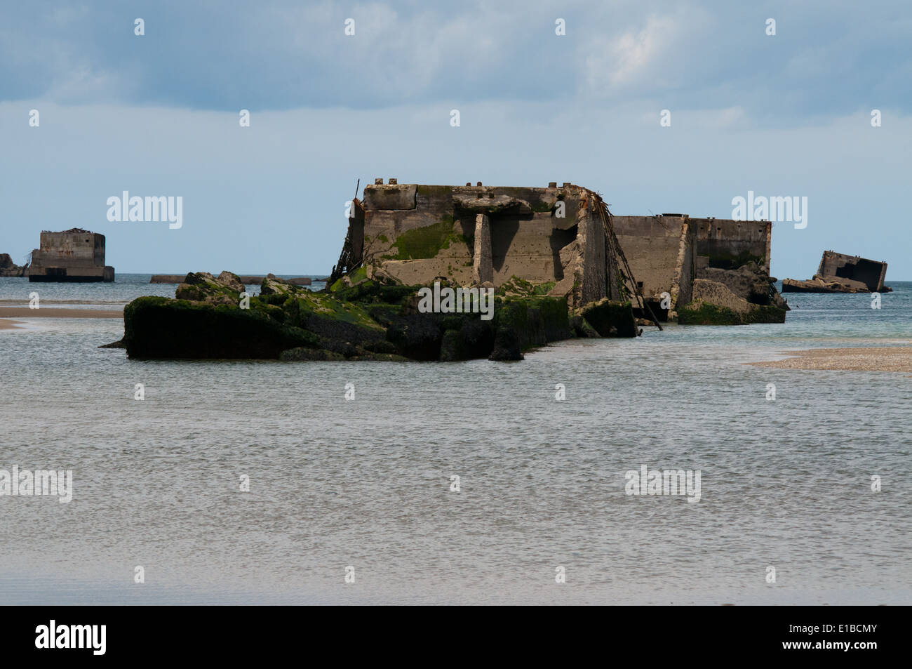 Sections of Mulberry Harbour at low tide at Asnelles, Gold Beach during ...