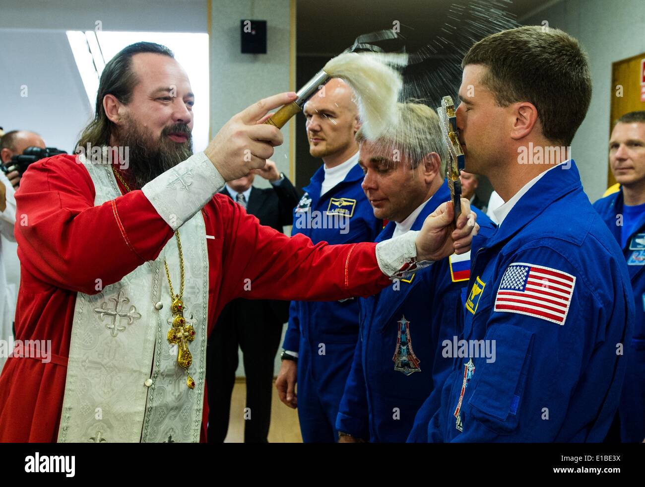 ISS Expedition 40 Flight Engineer Reid Wiseman of NASA, receives the ...